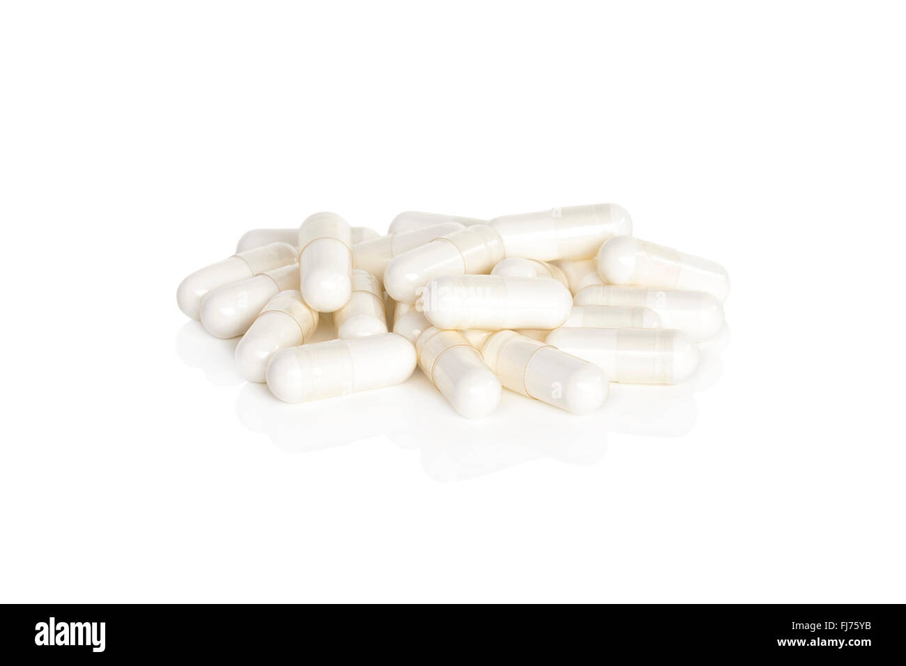 A pile of magnesium supplement capsules isolated on a white background ...