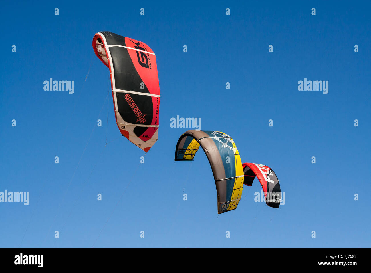three kites on blue sky background Stock Photo - Alamy