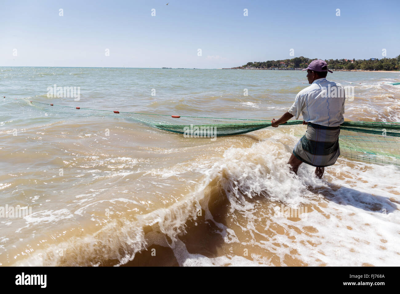 Fisherman pulling the net from the sea, Tangalle, Sri Lanka, Asia Stock ...