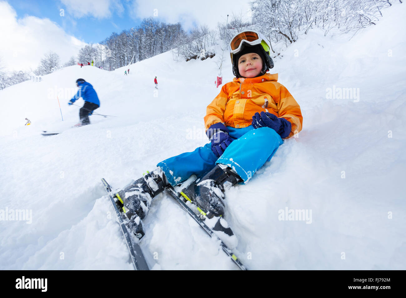 Child rest sitting in snow on side of ski track Stock Photo - Alamy