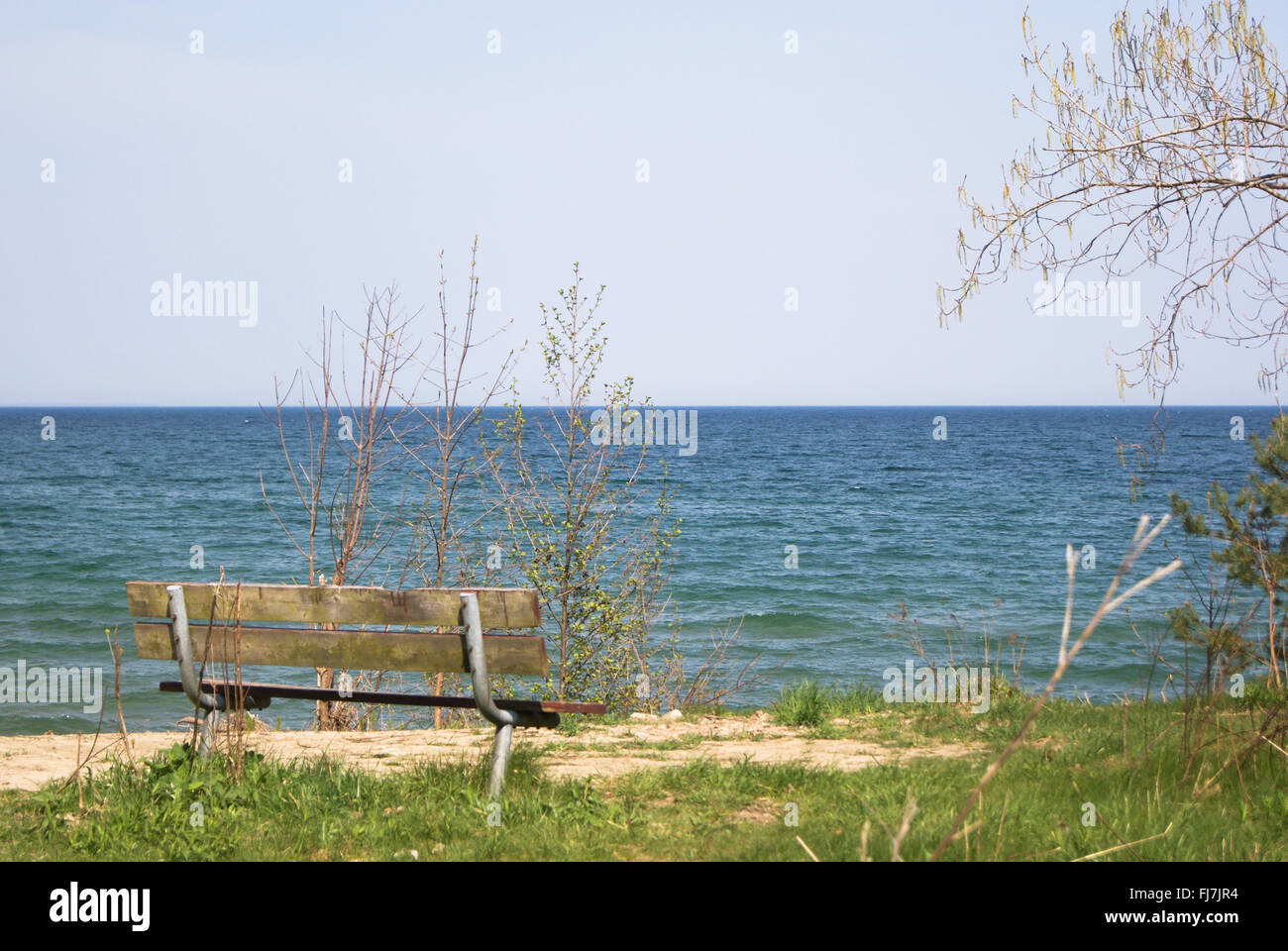 Bench by the lake Stock Photo - Alamy