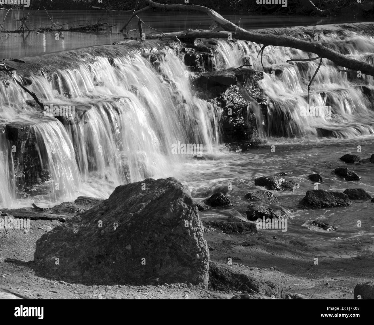 Flowing water over waterfall Stock Photo - Alamy