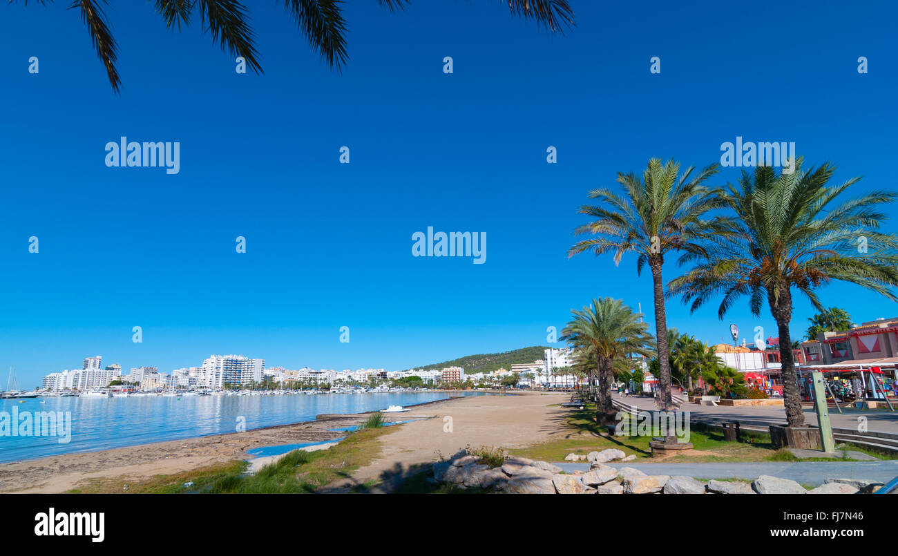 Mid morning sun on Ibiza waterfront. Warm sunny day along the beach in ...
