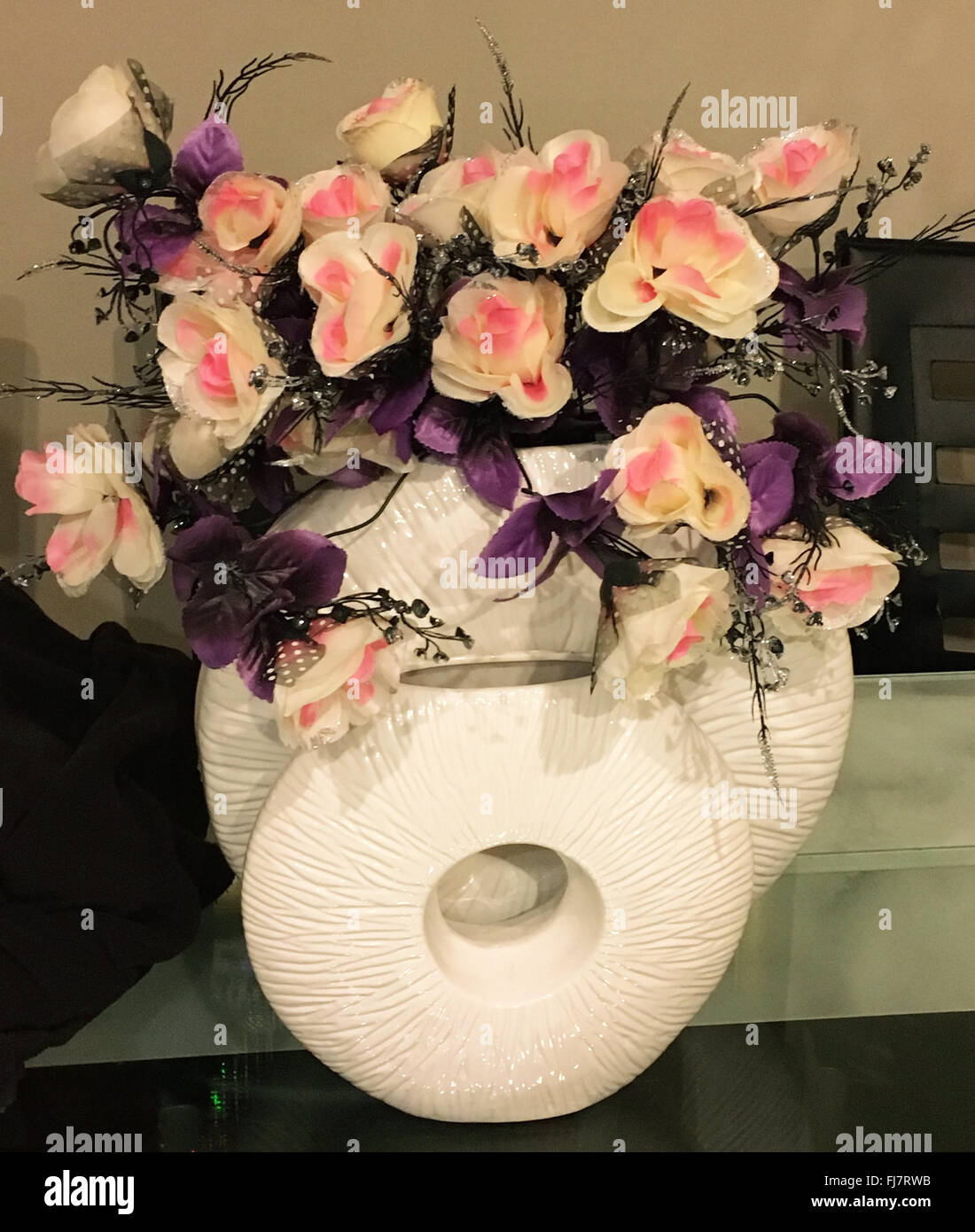 A fancy pot with flowers in it Stock Photo - Alamy