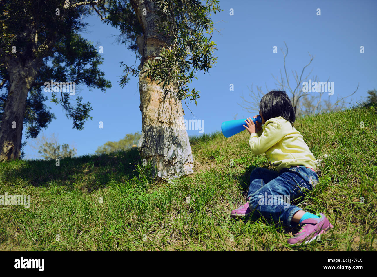 Girl yelling at the tree Stock Photo - Alamy