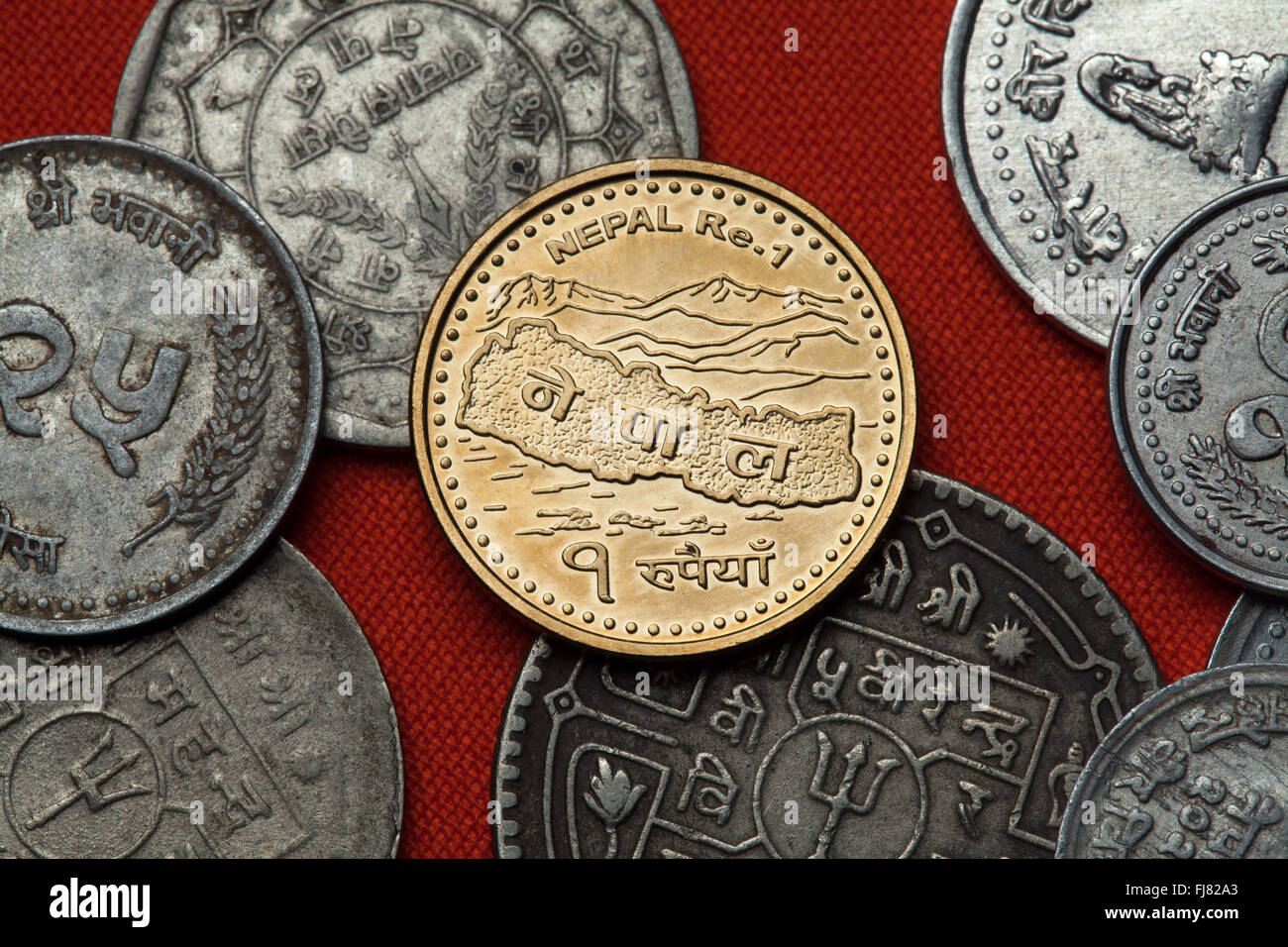 Coins of Nepal. Map of Nepal and the Himalayas depicted in the Nepalese ...
