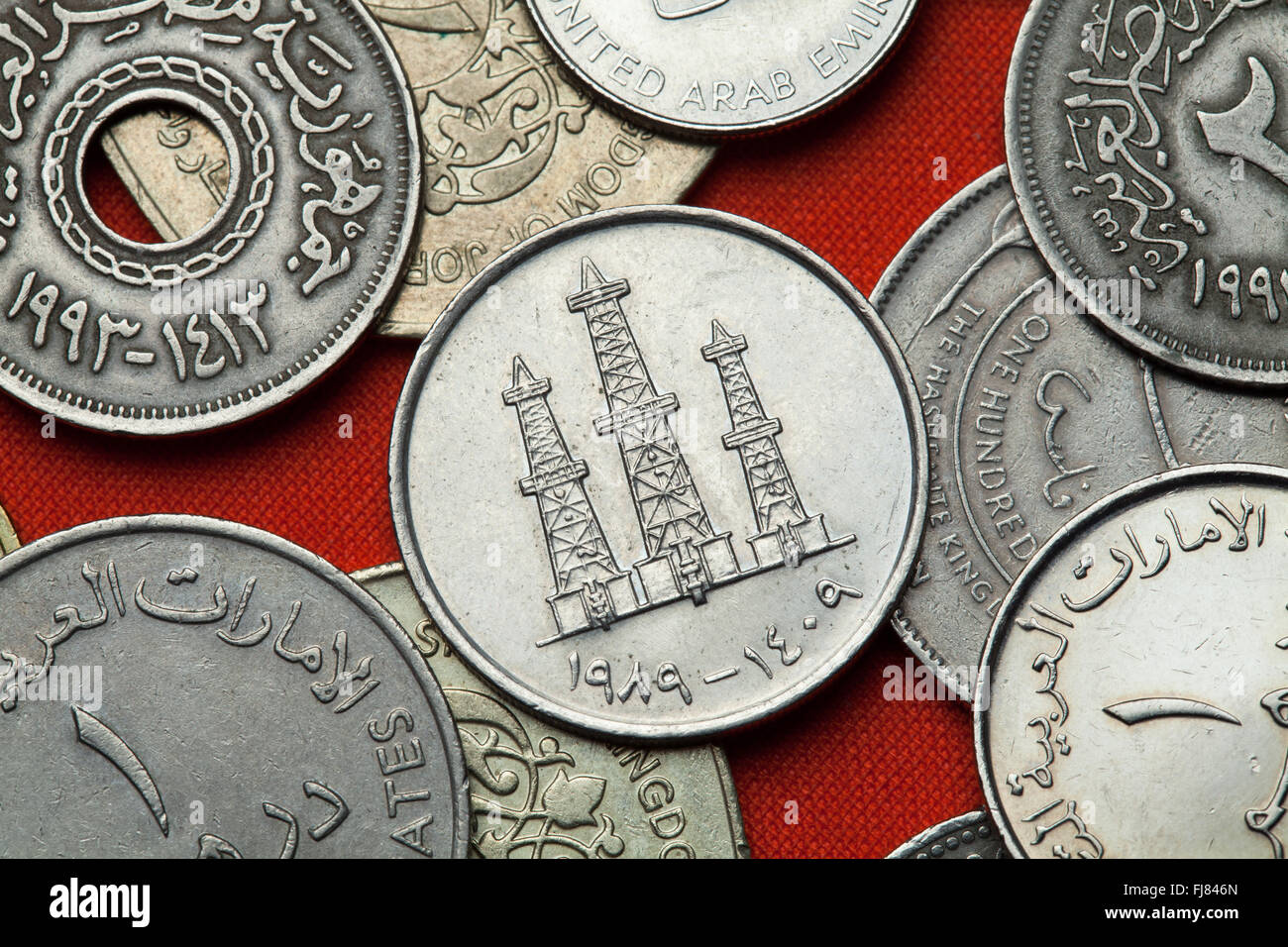 Coins of the United Arab Emirates. Oil derricks depicted in the UAE 50 ...