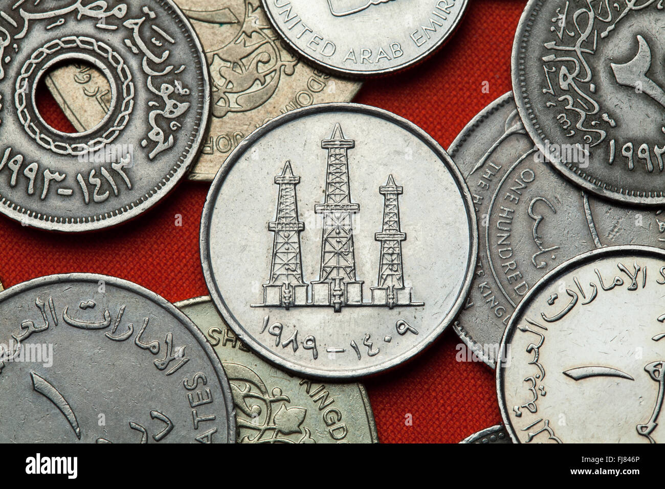 Coins of the United Arab Emirates. Oil derricks depicted in the UAE 50 ...