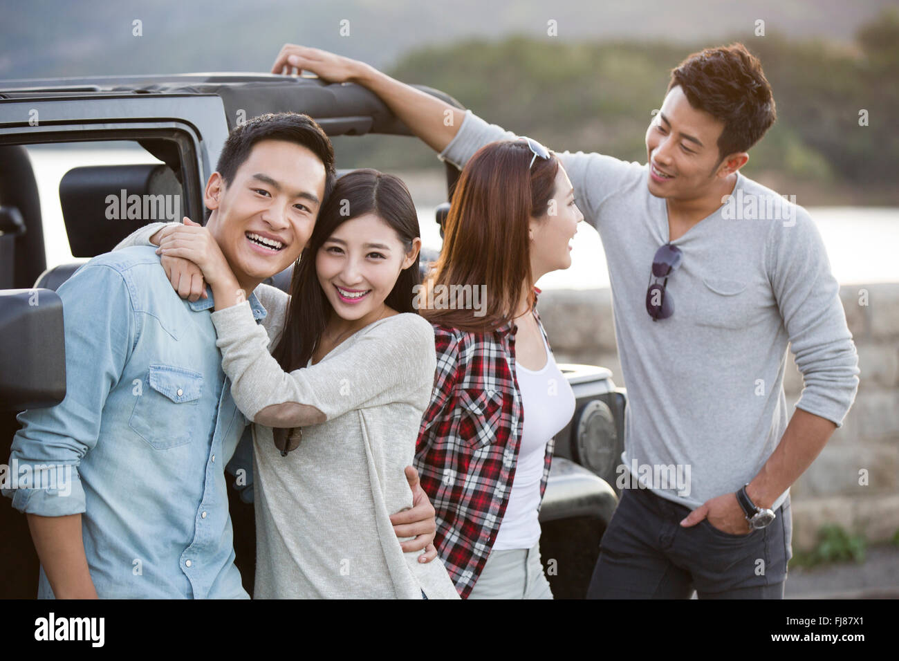 Young couple talking friends lake hi-res stock photography and images ...