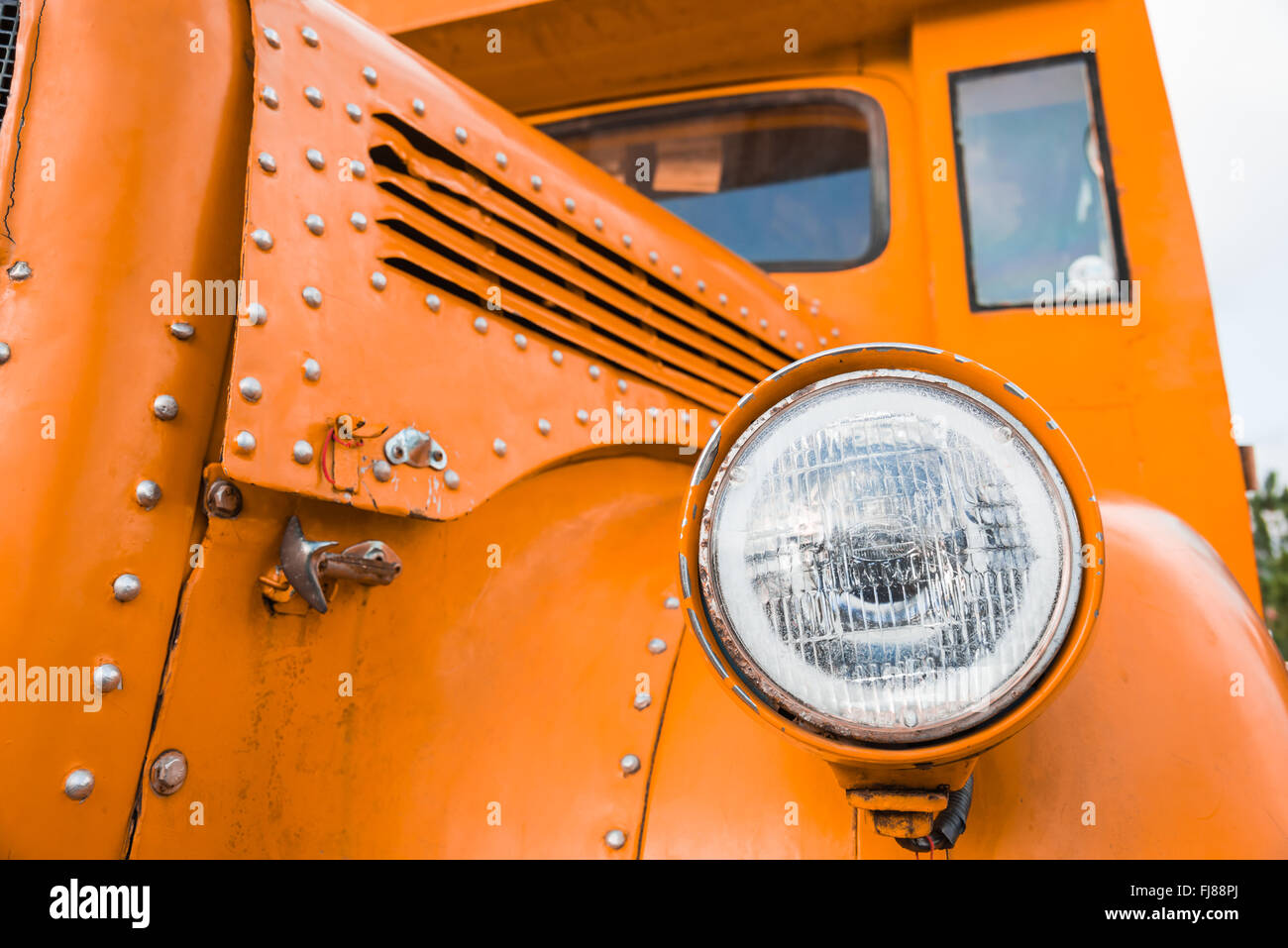 Front lamp of orange school bus Stock Photo - Alamy