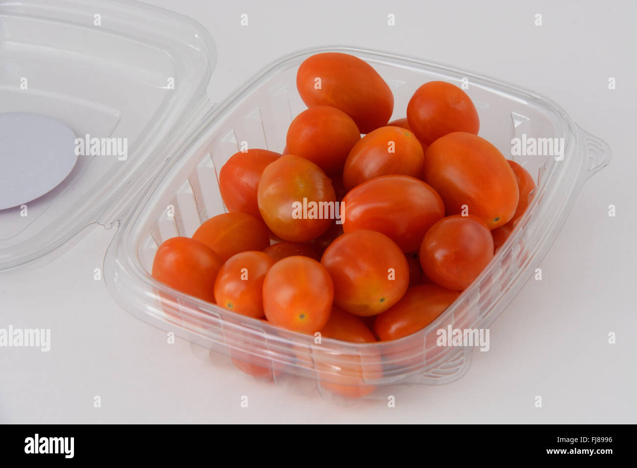 Grape tomatoes in grocery produce plastic packaging Stock Photo - Alamy