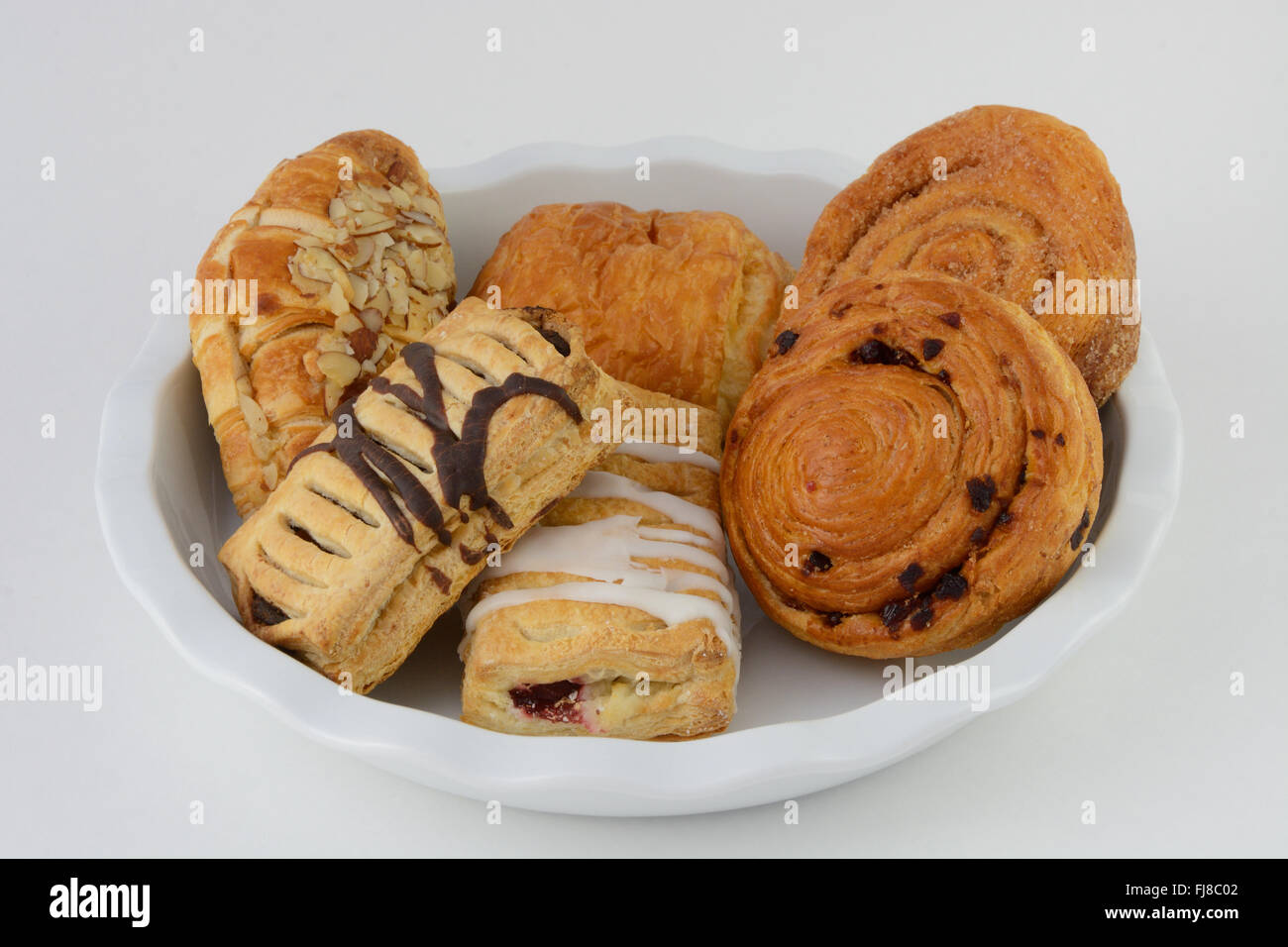 Assorted baked pastries on plate Stock Photo - Alamy