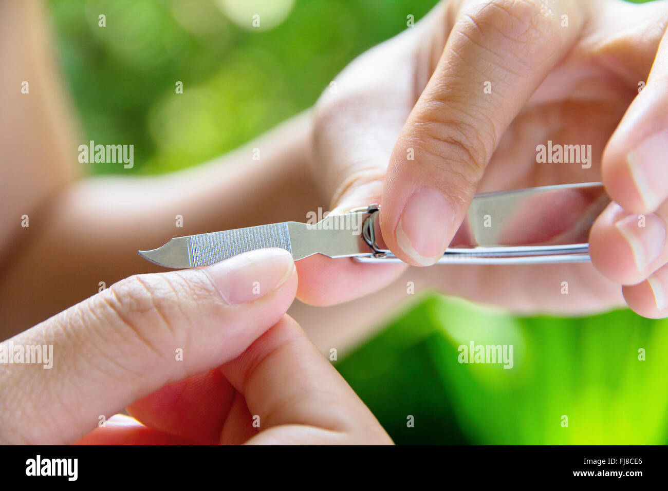 hand manicure with nail clipper Stock Photo - Alamy