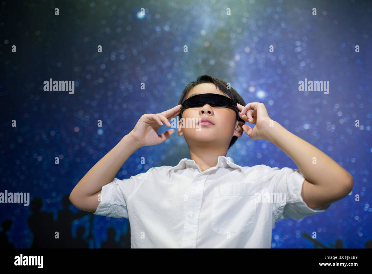 Little Chinese boy in science and technology museum Stock Photo - Alamy
