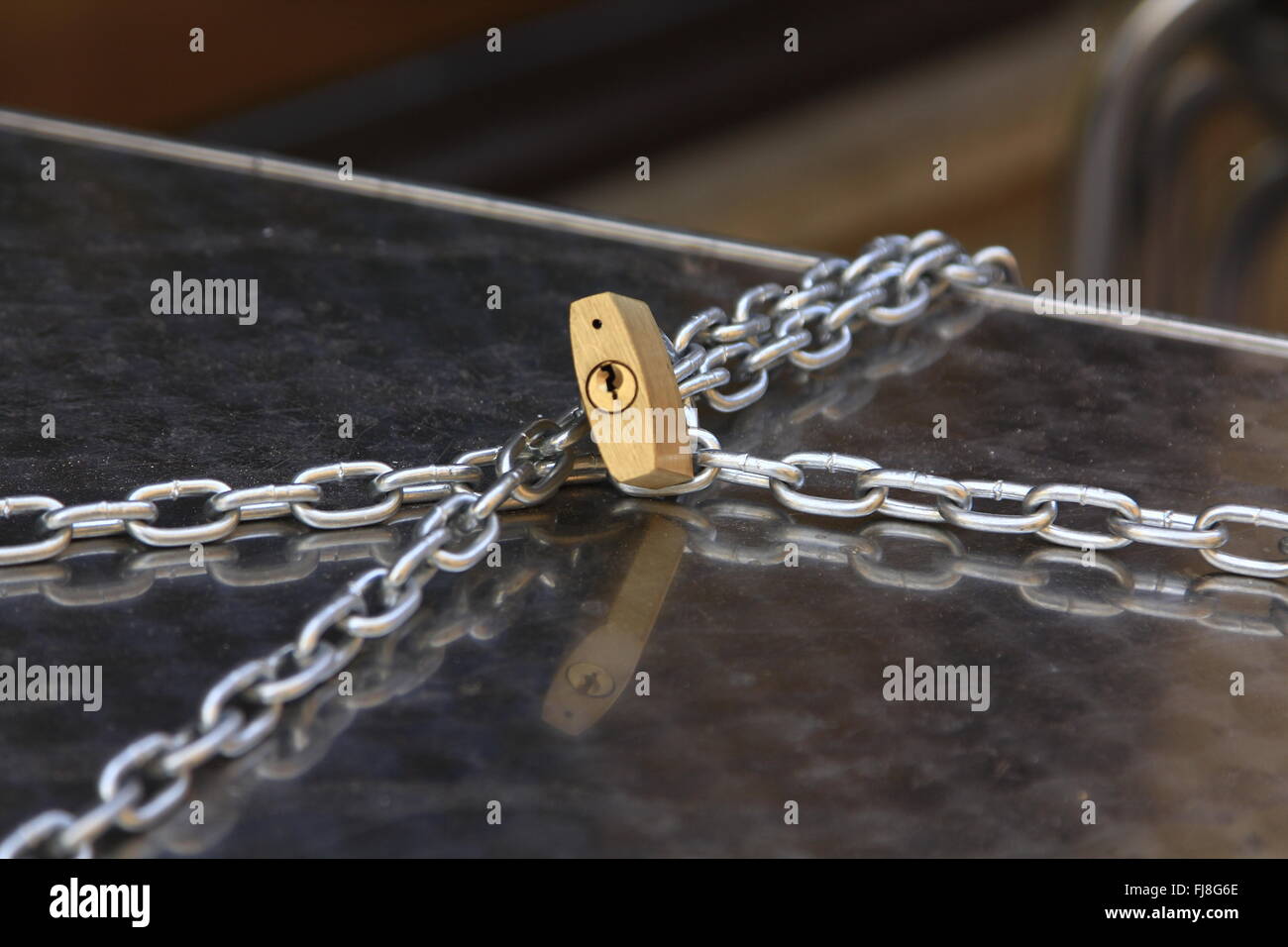 chains attached by a padlock Stock Photo - Alamy