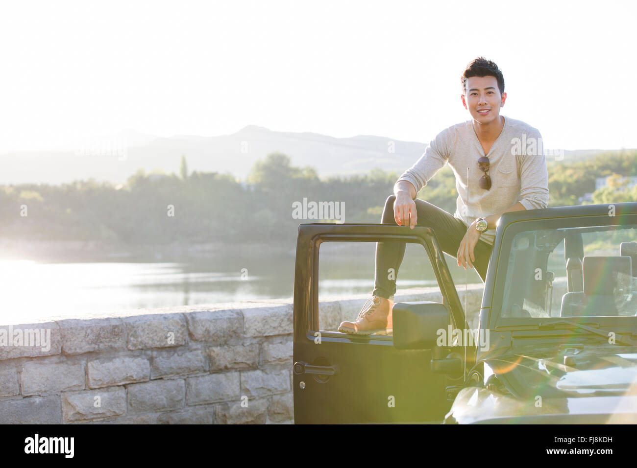 Chinese man standing 4x4 car hi-res stock photography and images - Alamy