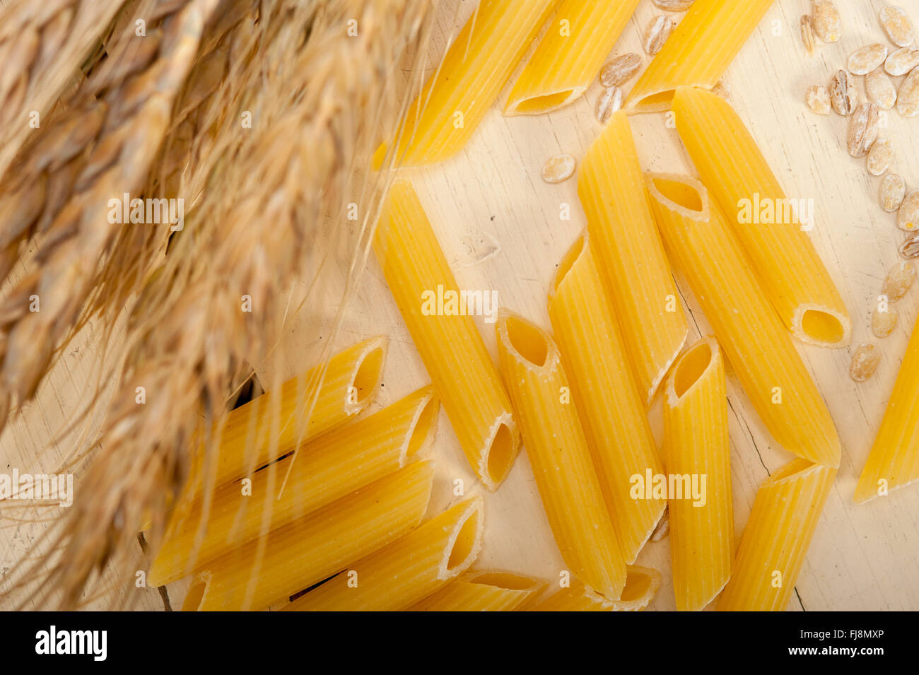 short Italian pasta penne with durum wheat grains Stock Photo - Alamy