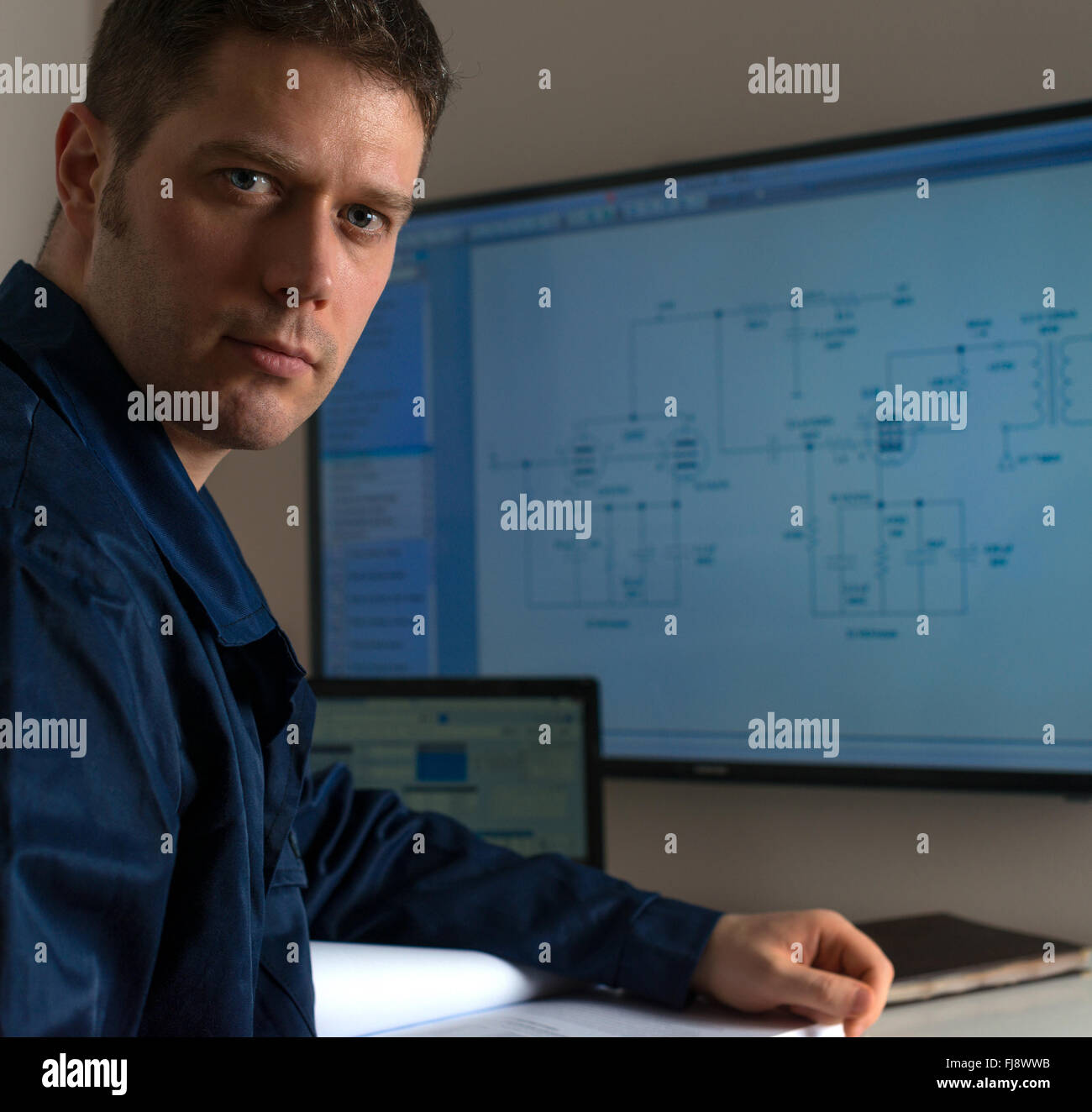 Male worker in thermal plant's control room Stock Photo - Alamy