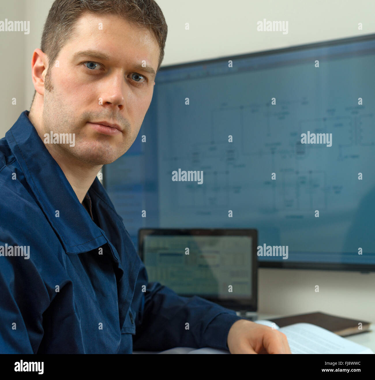 Male worker in thermal plant's control room Stock Photo - Alamy