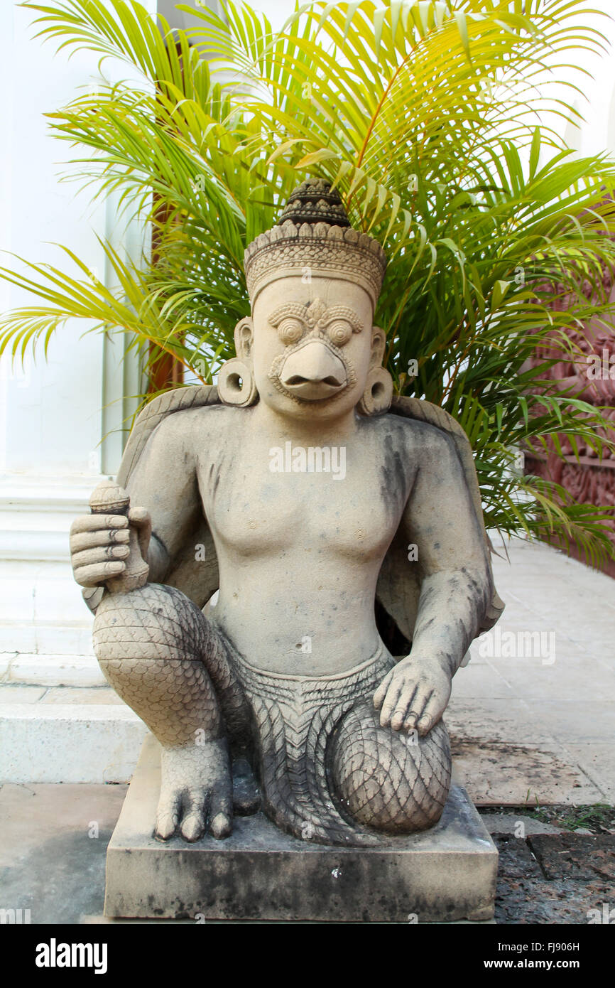 Stone Carving Statue with bright tree behind Stock Photo - Alamy