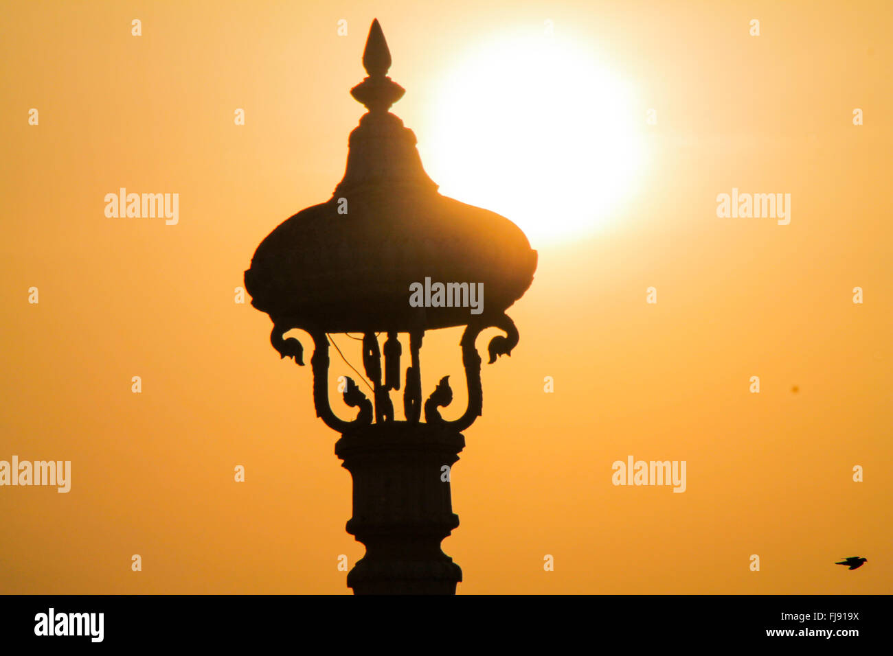 Lamp post with background sunset Stock Photo - Alamy