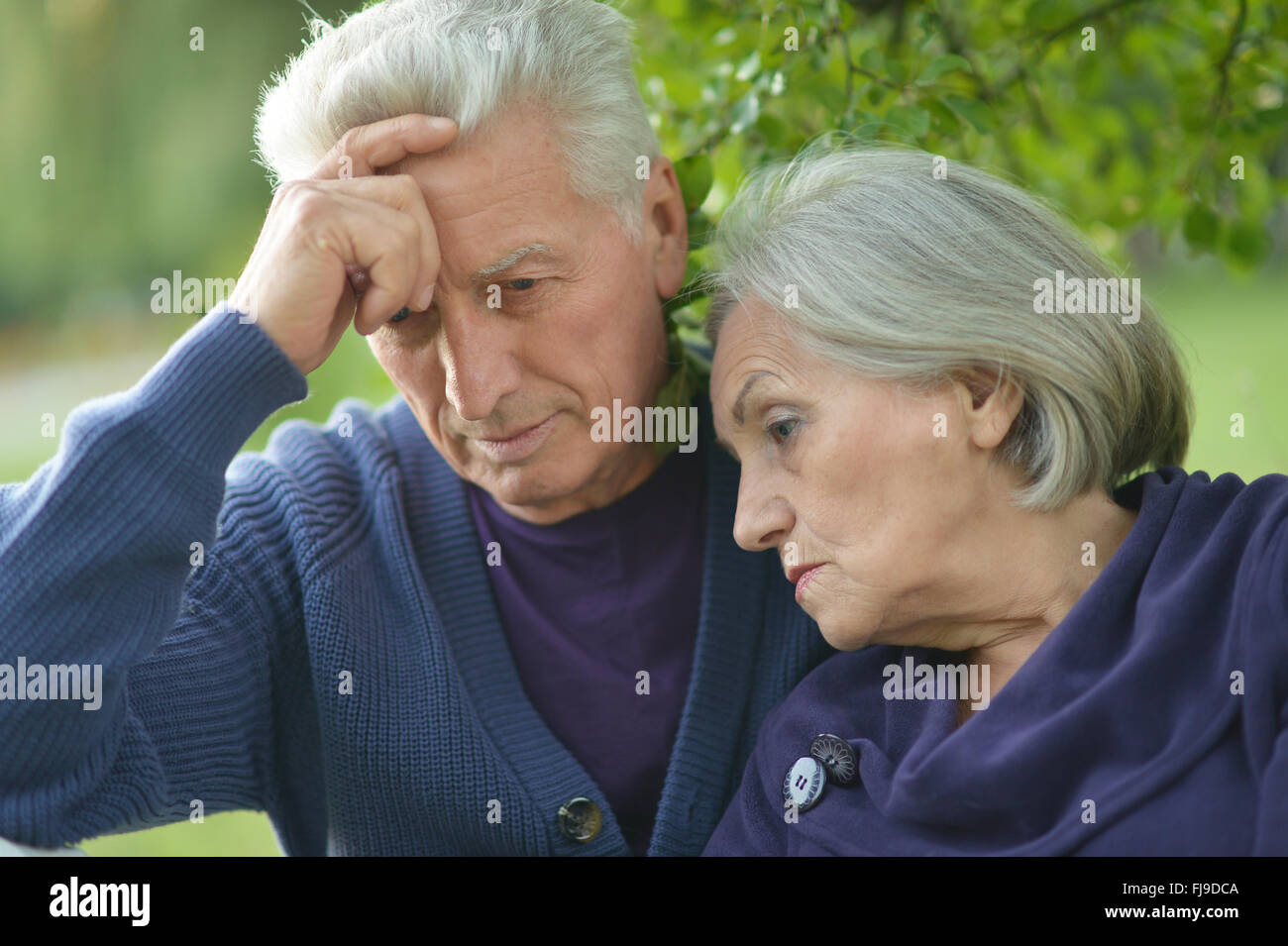 sad elder couple Stock Photo - Alamy