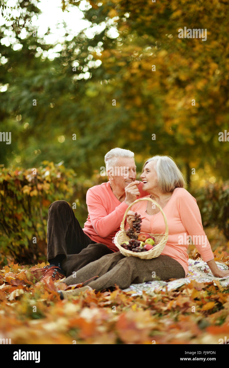 Couple in autumn park Stock Photo - Alamy