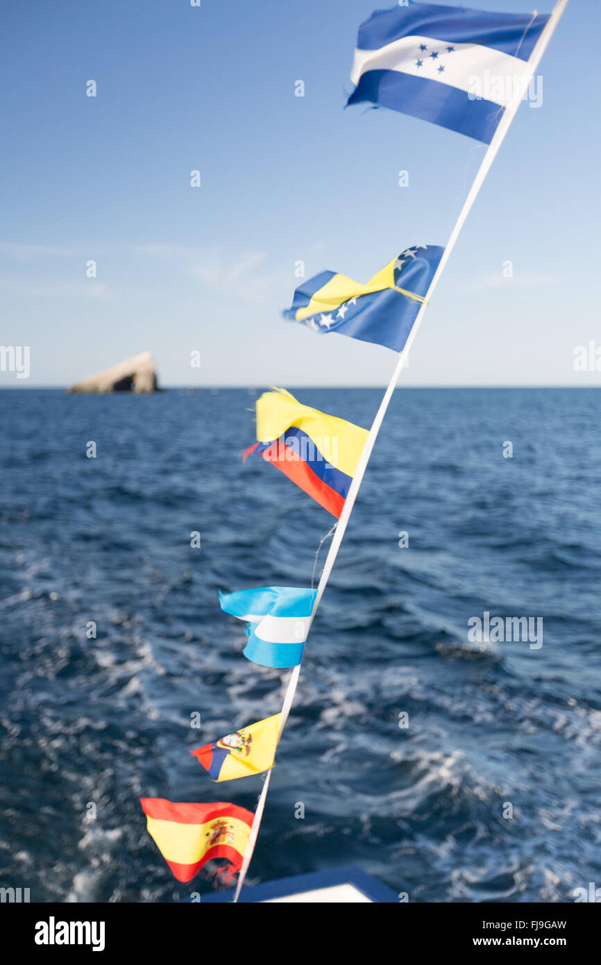 Some national flags fluttering on the rope Stock Photo - Alamy