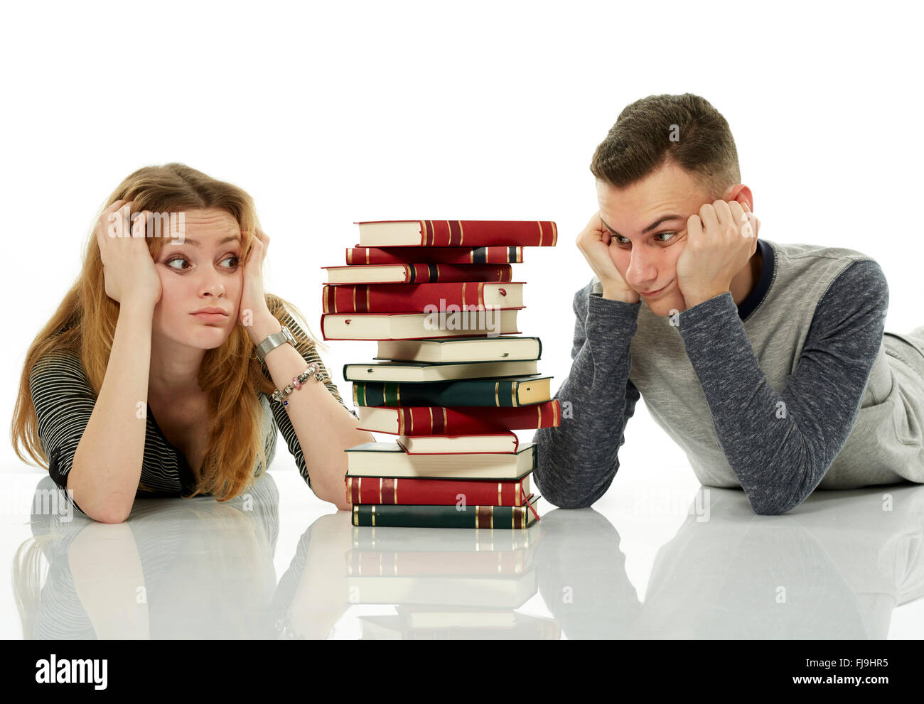 Students doing homework together, unhappy with the number of books they ...
