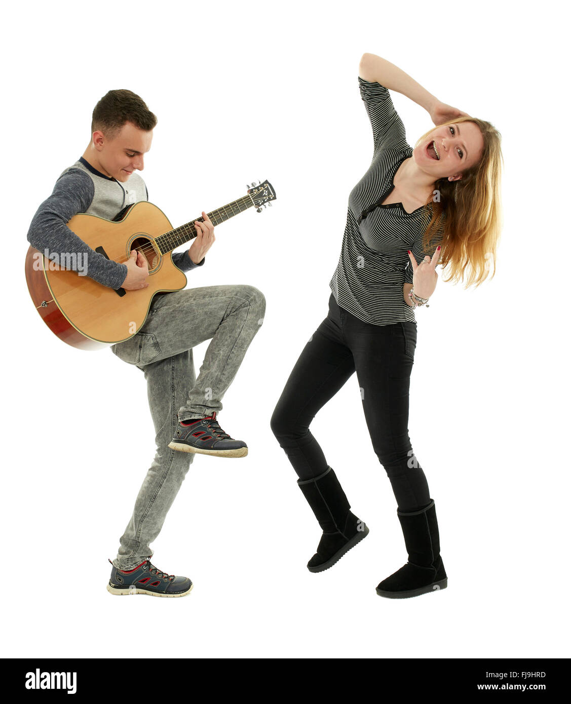 Boy playing guitar smiling Cut Out Stock Images & Pictures - Alamy
