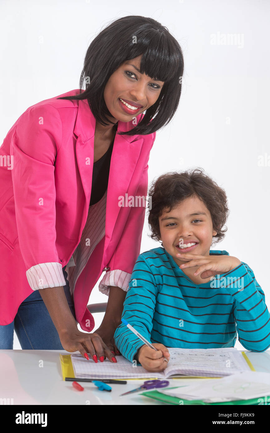 Portrait of mom helping son with homework Stock Photo - Alamy