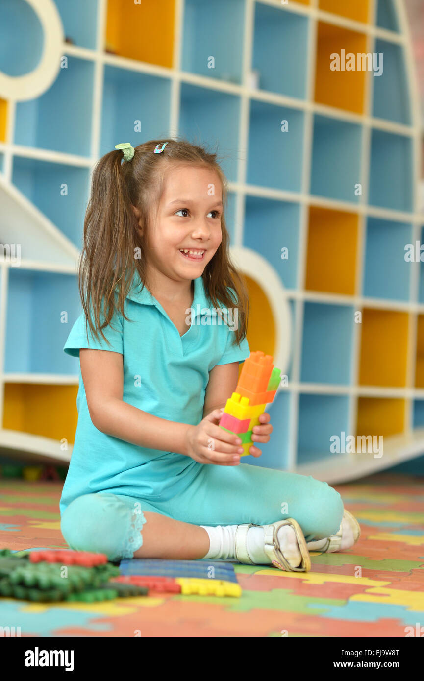 Happy Little girl playing Stock Photo - Alamy