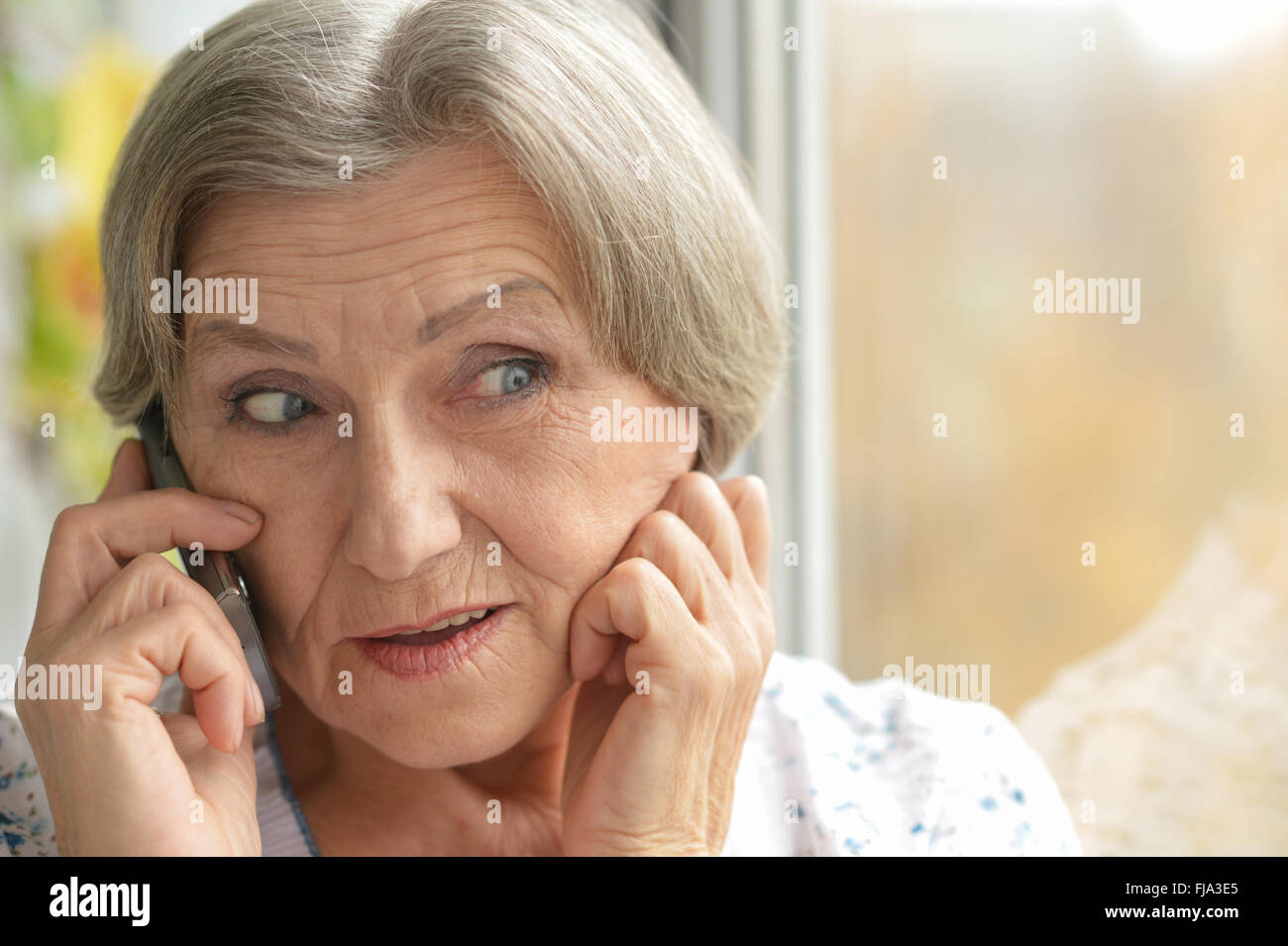 woman calling at home Stock Photo - Alamy
