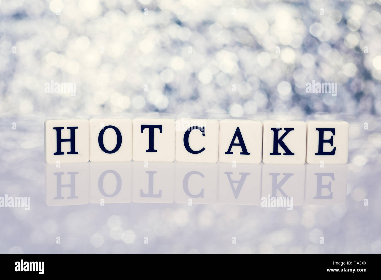 Written word of tiles with letters - hotcake Stock Photo - Alamy