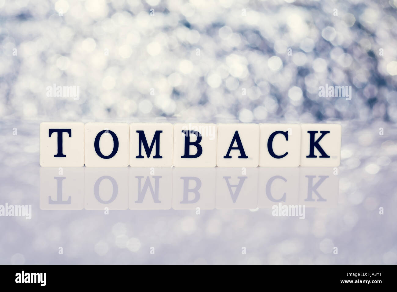 Written word of tiles with letters - tomback Stock Photo - Alamy