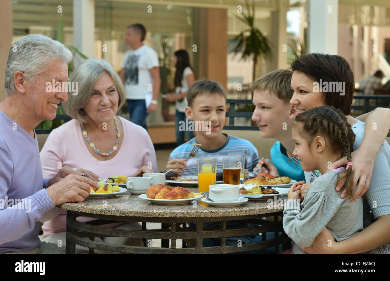 Happy family at breakfast Stock Photo - Alamy