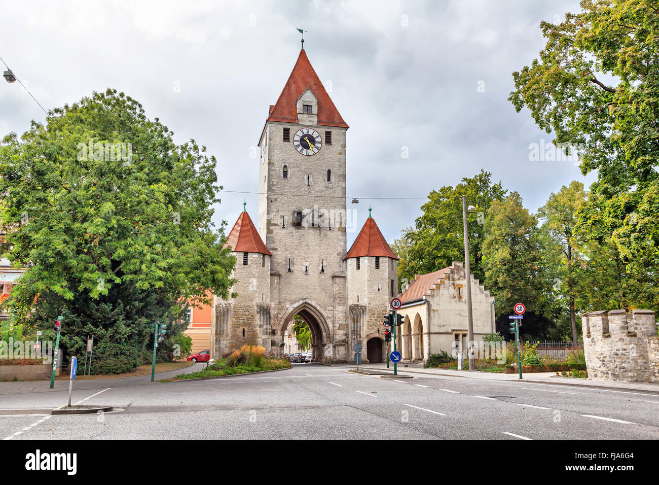 Medieval eastern city gate with clock tower in Regensburg, Germany ...