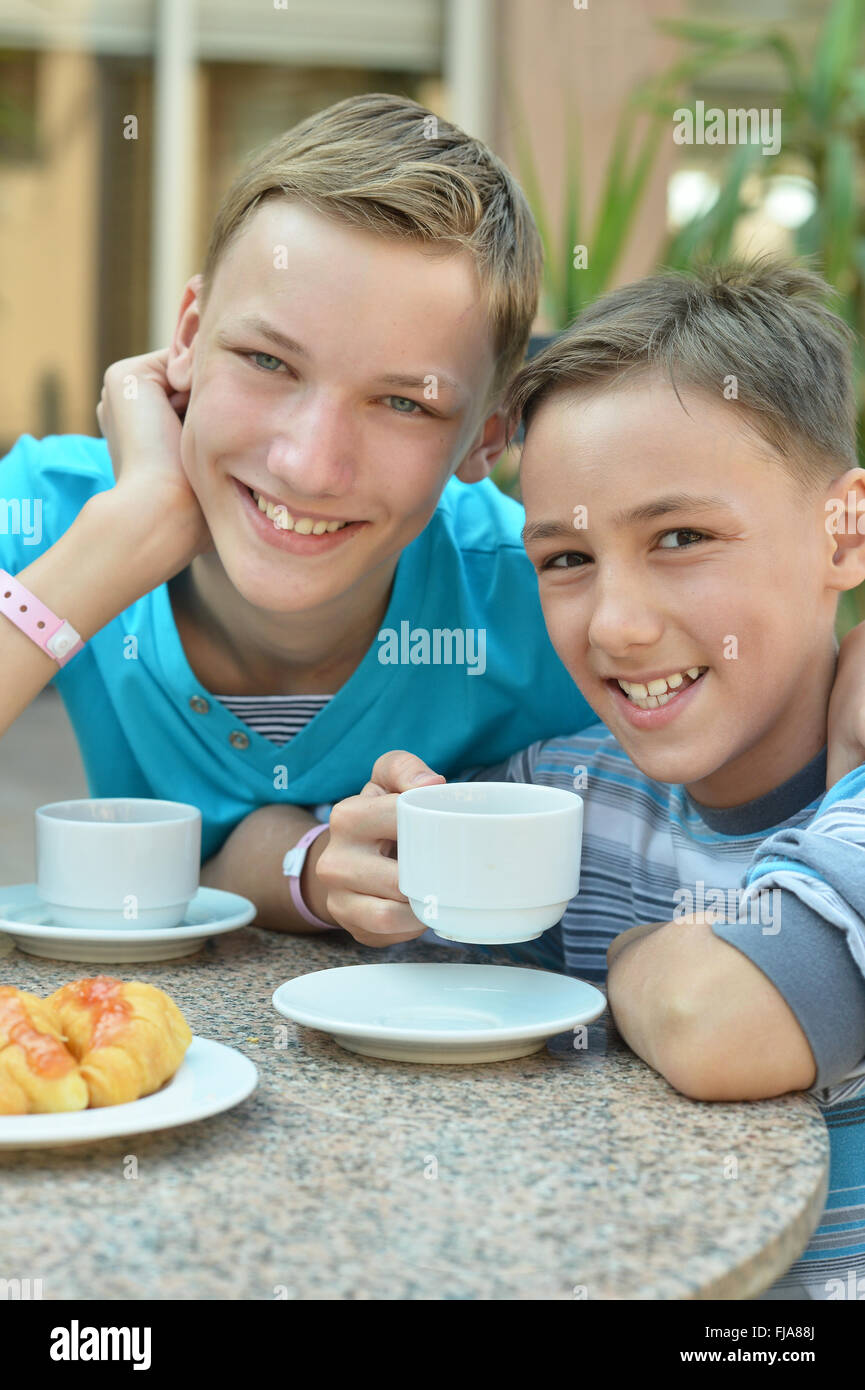 Happy boys at breakfast Stock Photo - Alamy