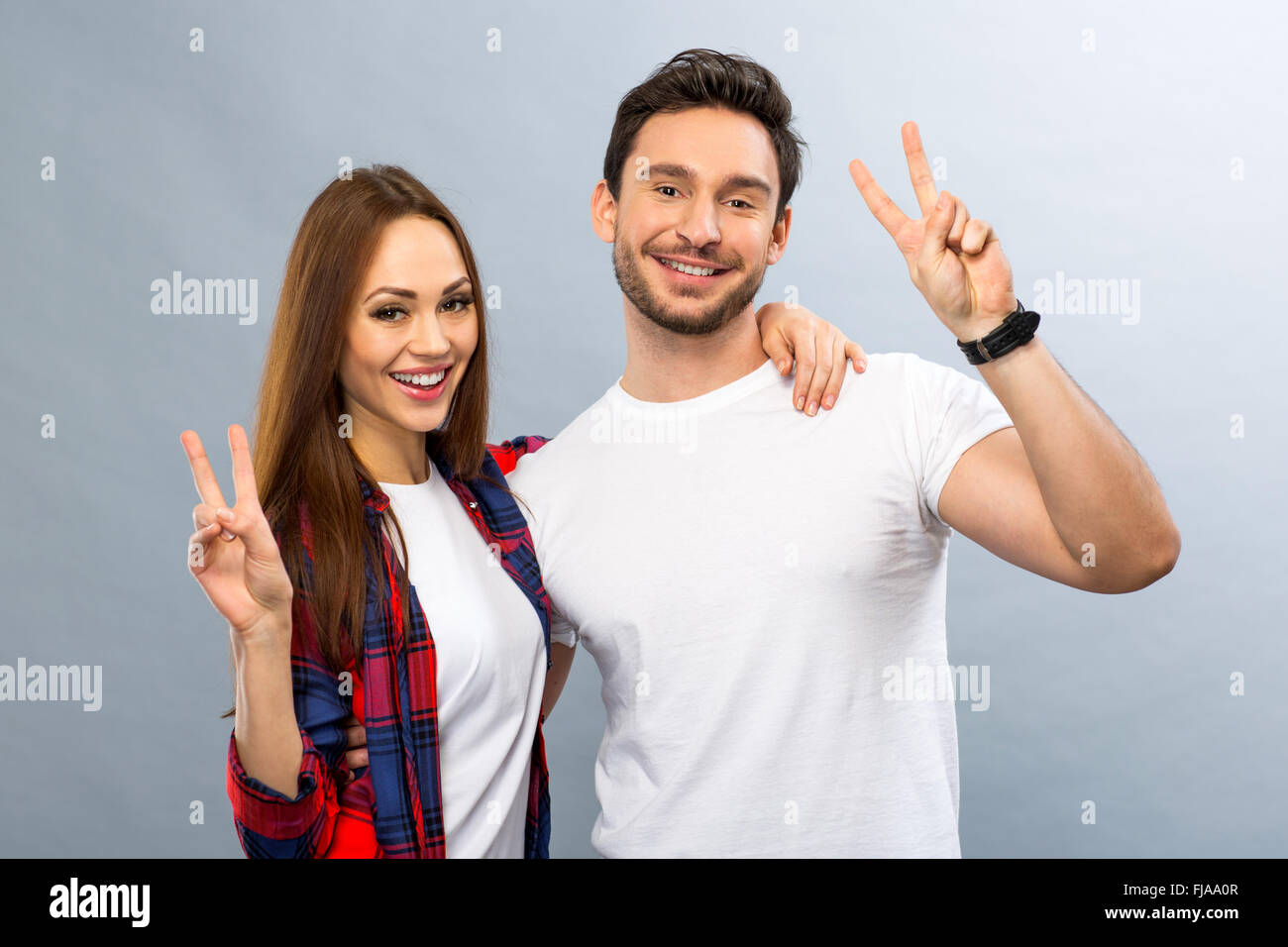 Joyful young couple expressing positivity Stock Photo - Alamy