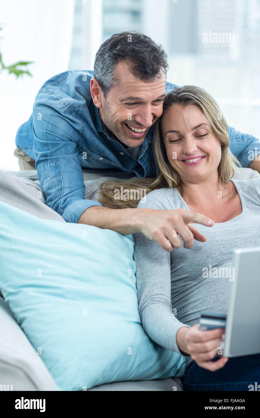 Couple looking at laptop Stock Photo - Alamy