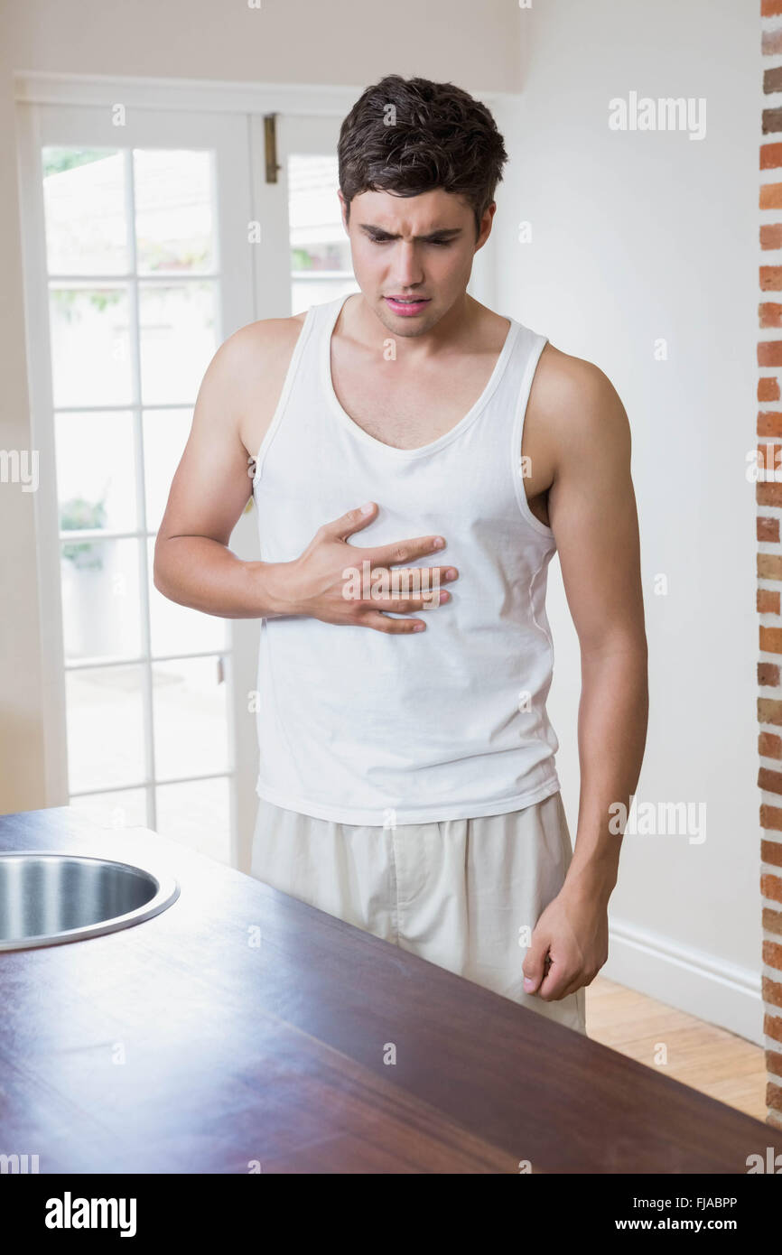 Young man feeling hungry Stock Photo - Alamy