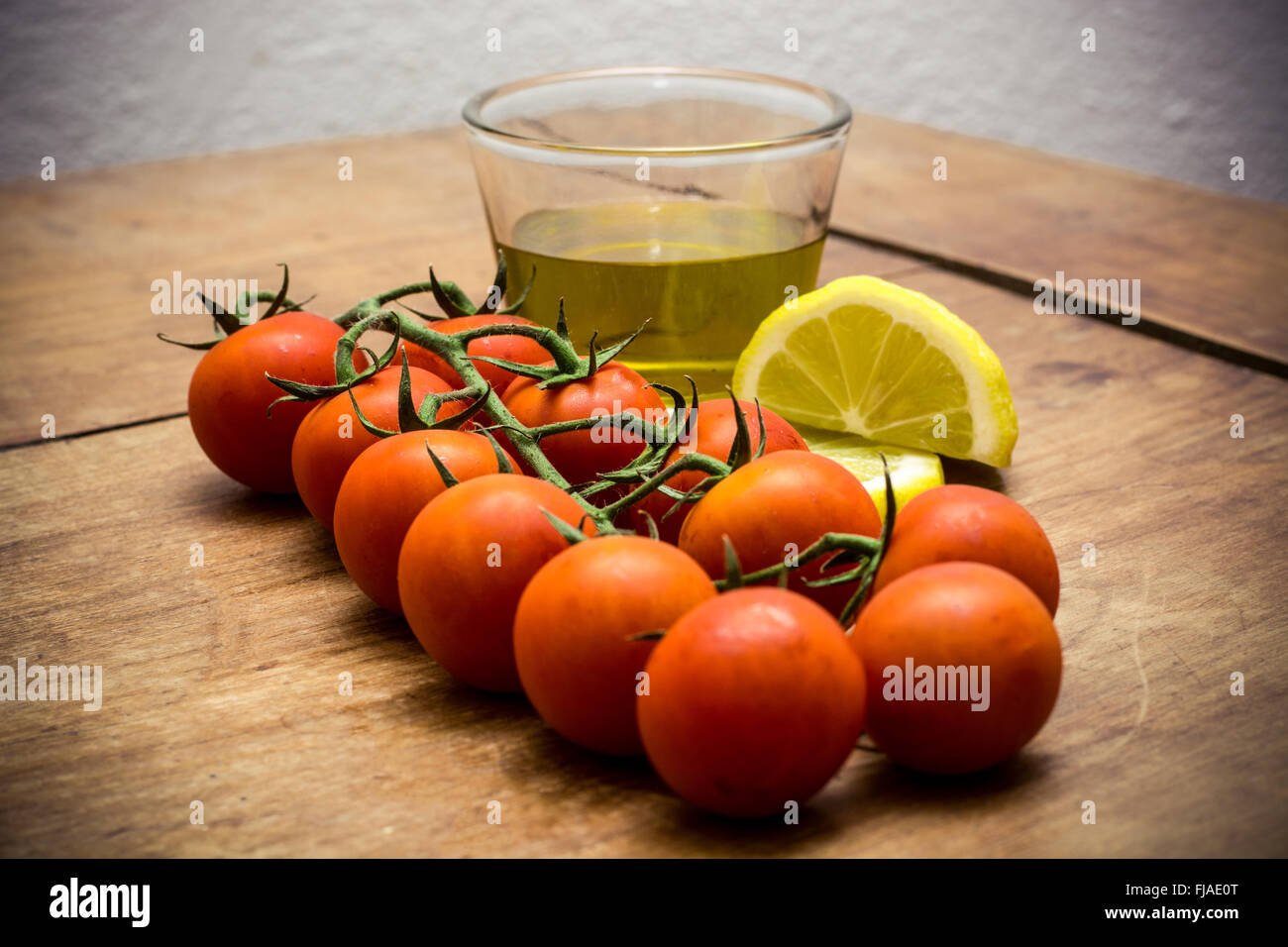 Mediterranean tomato with its olive oil and lemon Stock Photo - Alamy