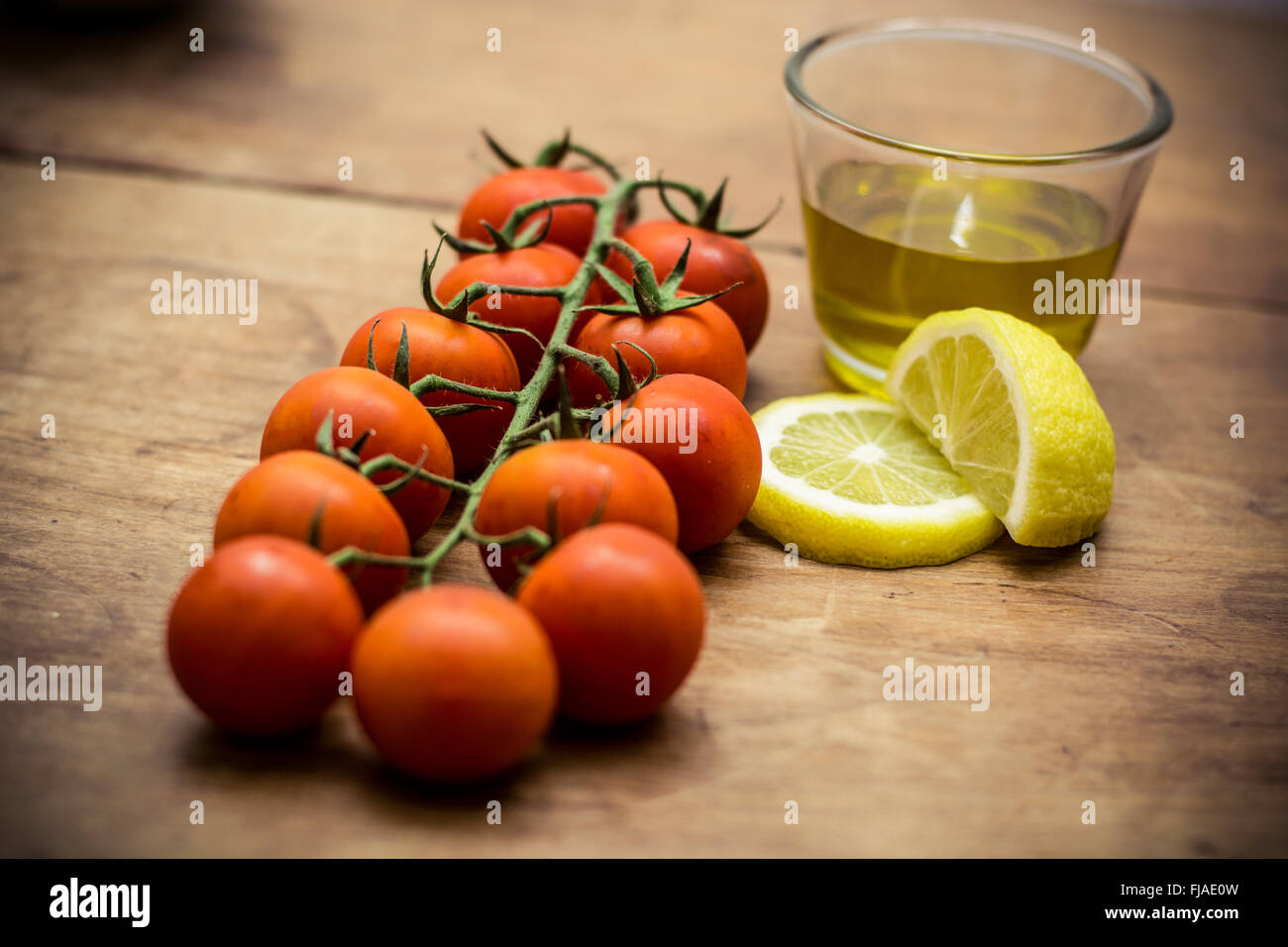 Mediterranean tomato with its olive oil and lemon Stock Photo - Alamy