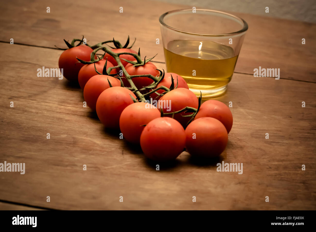 Mediterranean tomato with its olive oil Stock Photo - Alamy