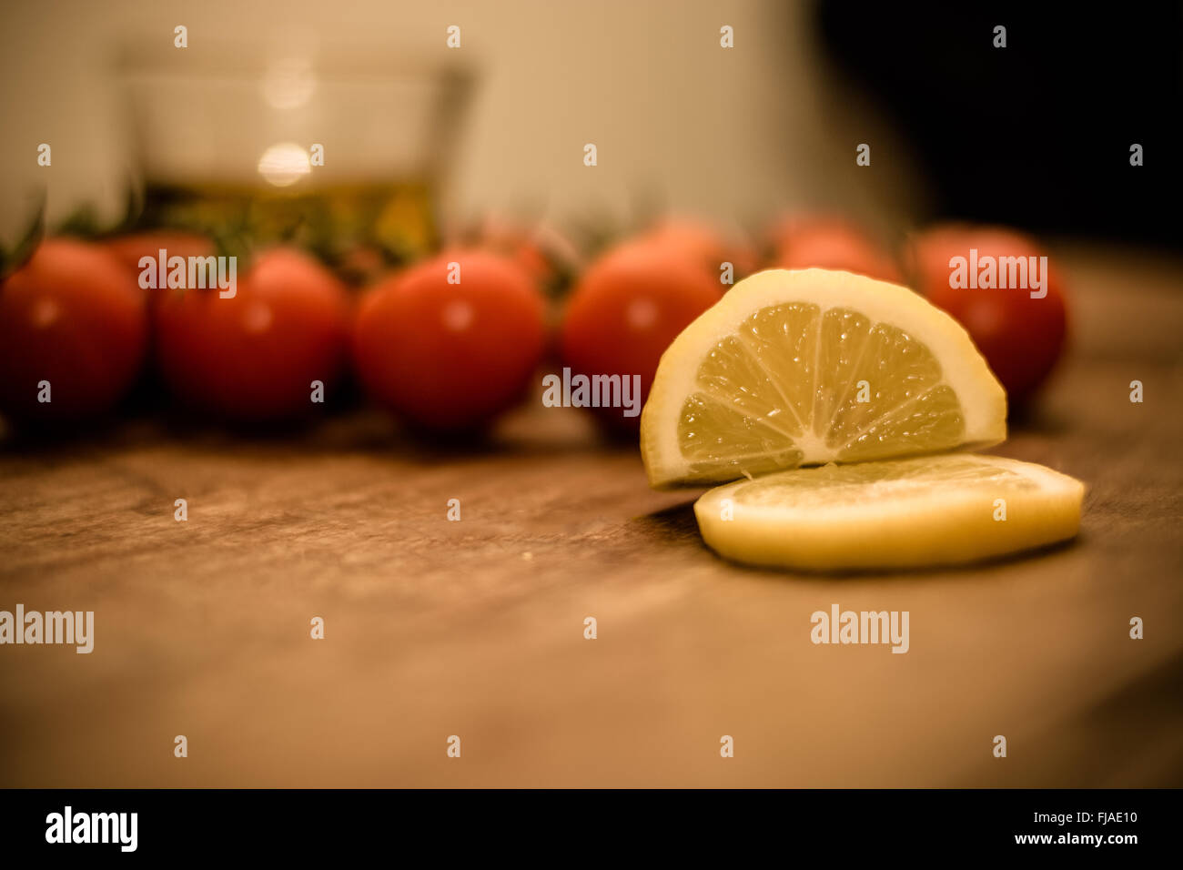 Mediterranean tomato with its olive oil and lemon Stock Photo - Alamy