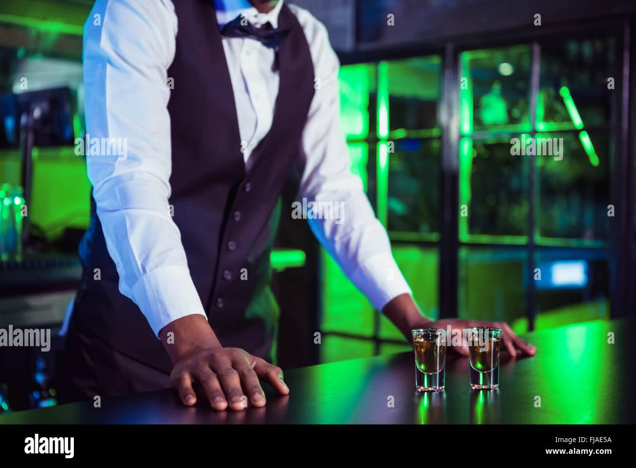 Bartender leaning on counter hi-res stock photography and images - Alamy