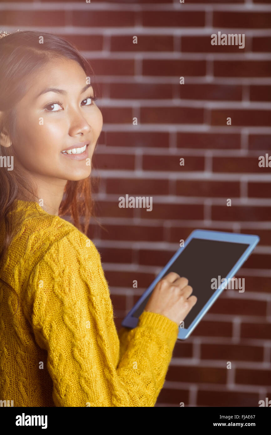 Smiling asian woman using tablet Stock Photo - Alamy