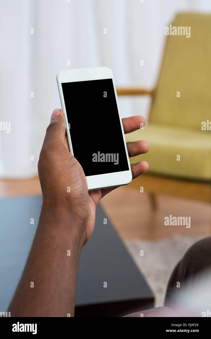 Mans hand holding a phone Stock Photo - Alamy