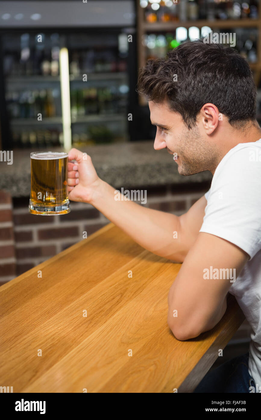 Happy man having a beer Stock Photo - Alamy