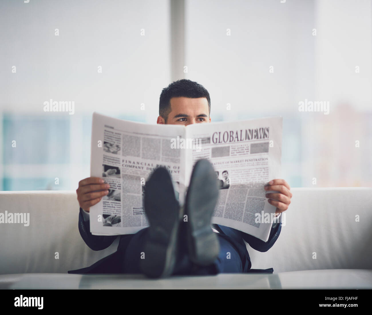 Reading newspaper hi-res stock photography and images - Alamy